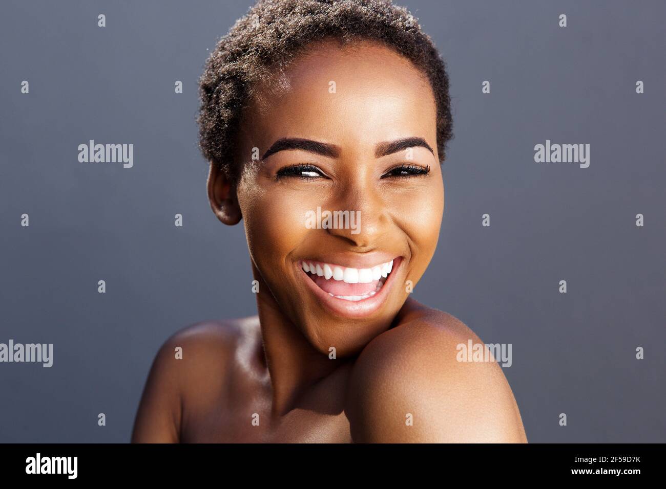 Close up beauty portrait of black female fashion model smiling Stock ...