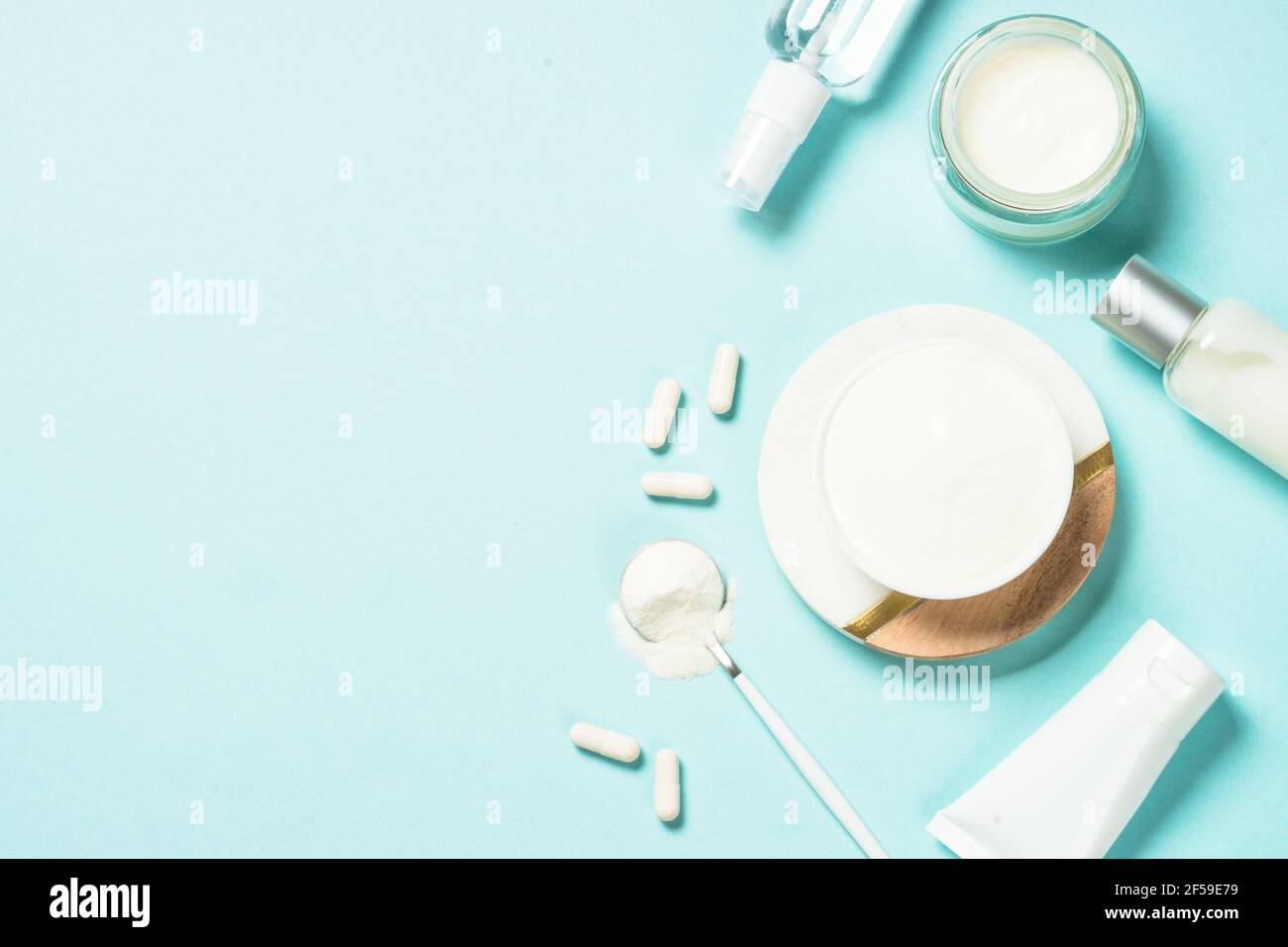 Collagen powder dietary supplement at blue background Stock Photo - Alamy