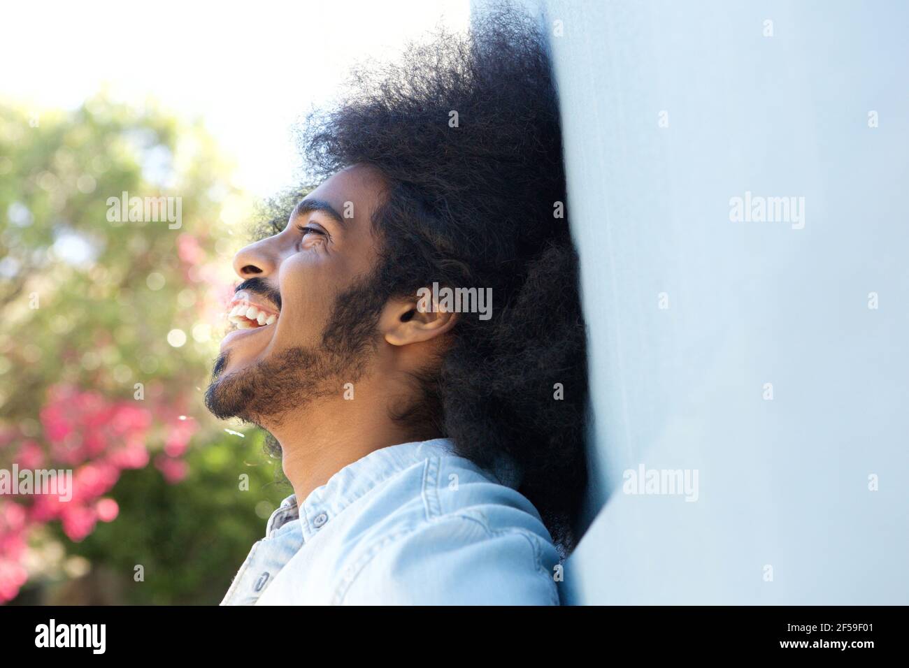 Indian man smiling side profile hi-res stock photography and images - Alamy