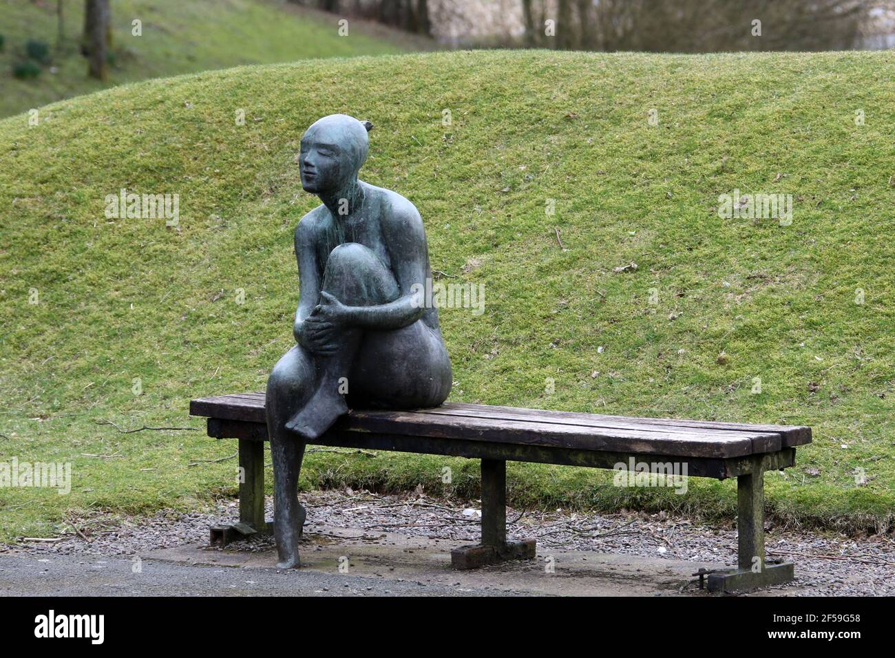 Clasping her knee hi-res stock photography and images - Alamy