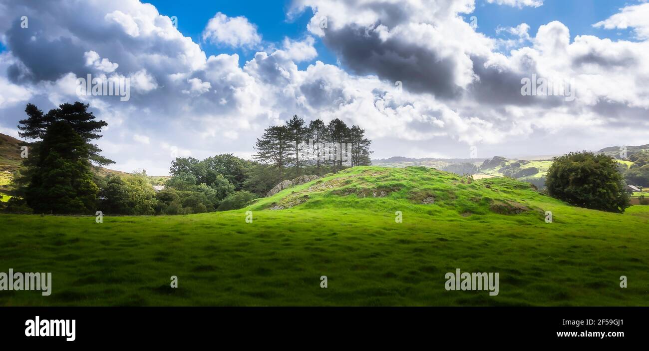 Blue sky with clouds over the beautiful green valley with trees in the ...