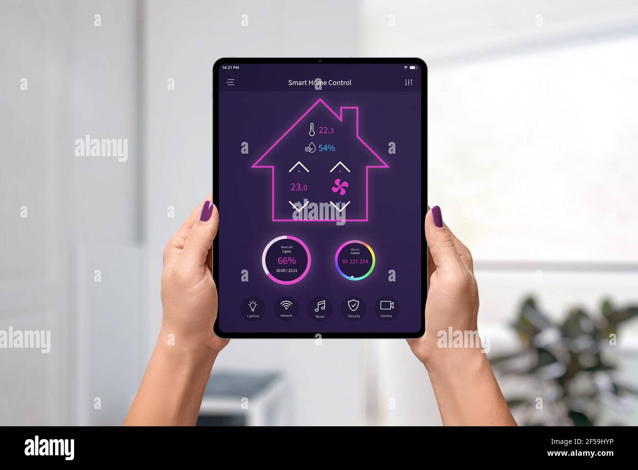 Smart home control app on tablet in woman hands. Home interior in ...