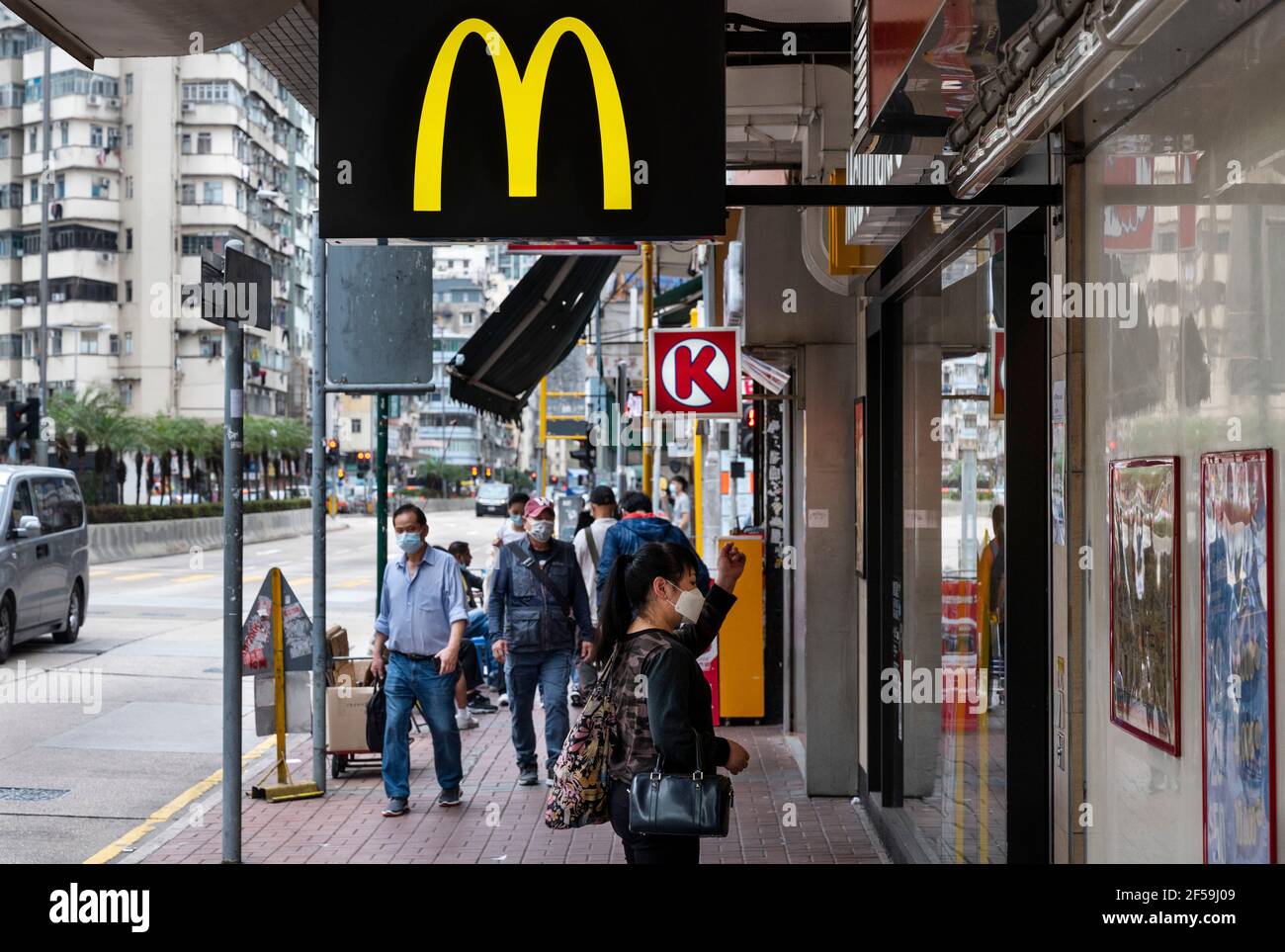 Pedestrians walk past the American multinational fast-food hamburger ...