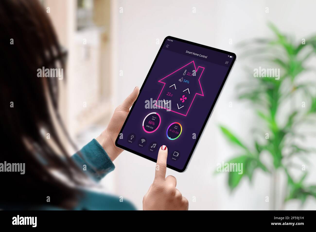 Smart home control app concept on tablet in woman hands. Home interior ...