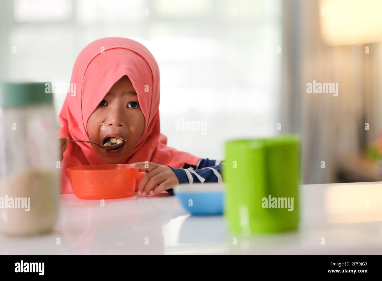 Muslim child eating hi-res stock photography and images - Alamy