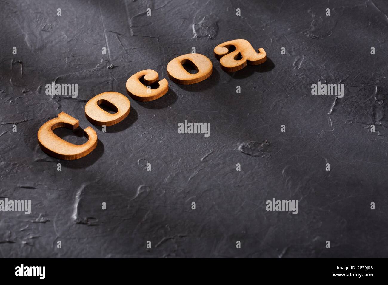 Word cocoa in wooden letters - Theobroma cacao Stock Photo - Alamy
