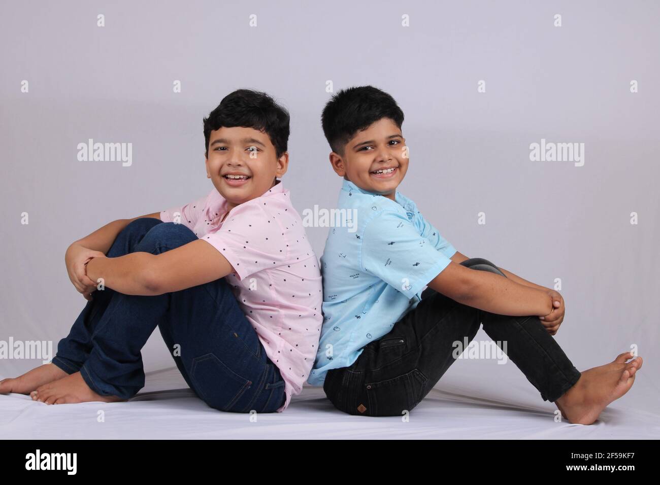 cheerful indian siblings hugging and posing for a photo Stock Photo - Alamy