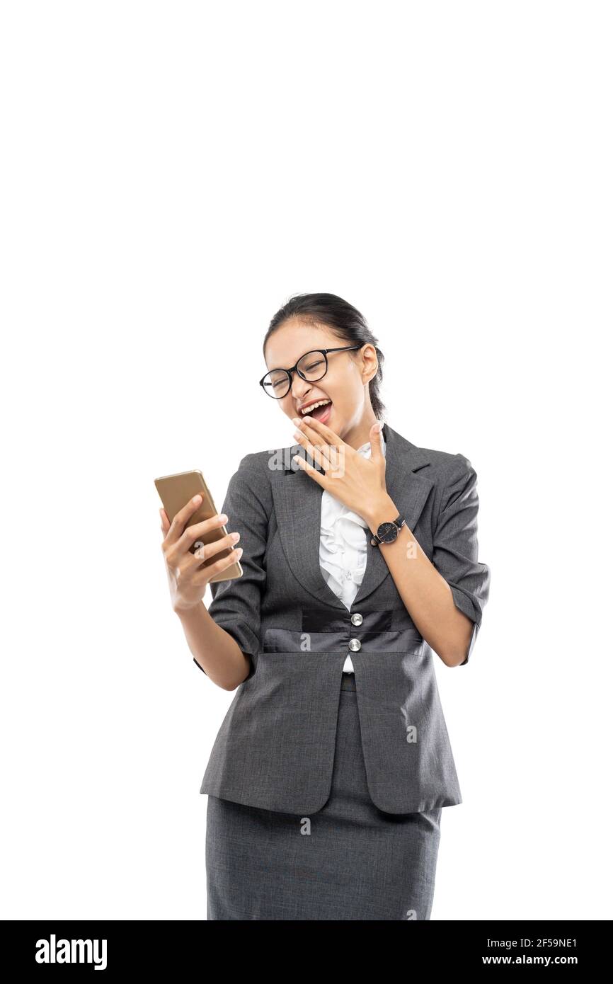 Beautiful businesswoman holding and look handphone with happiness ...