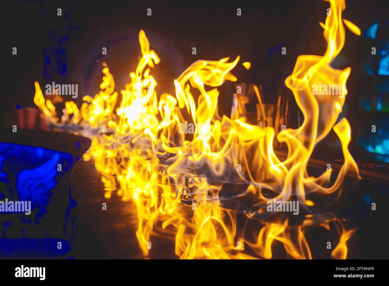 Flame fire on bar counter nightclub background Stock Photo - Alamy