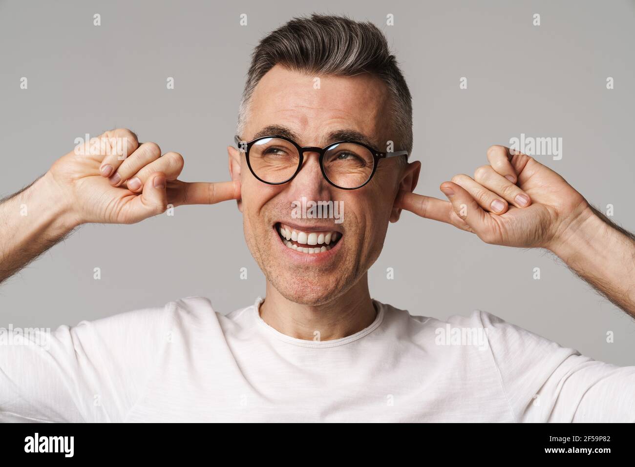 Blocking ears hi-res stock photography and images - Alamy