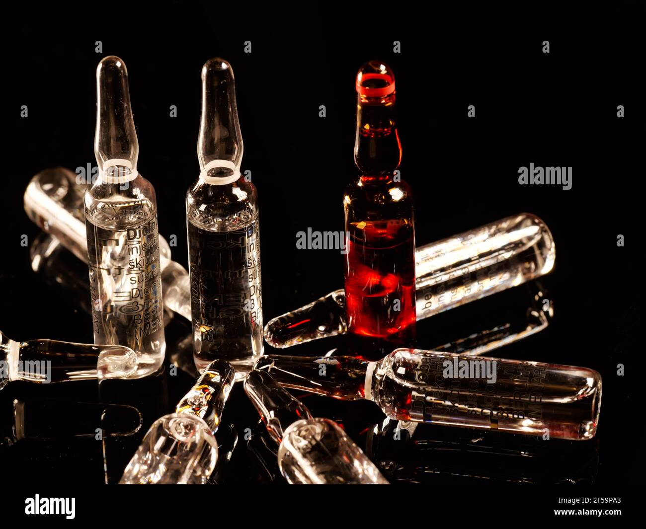 Medical ampoules close up. Many ampoules. Glass ampoules on the table ...