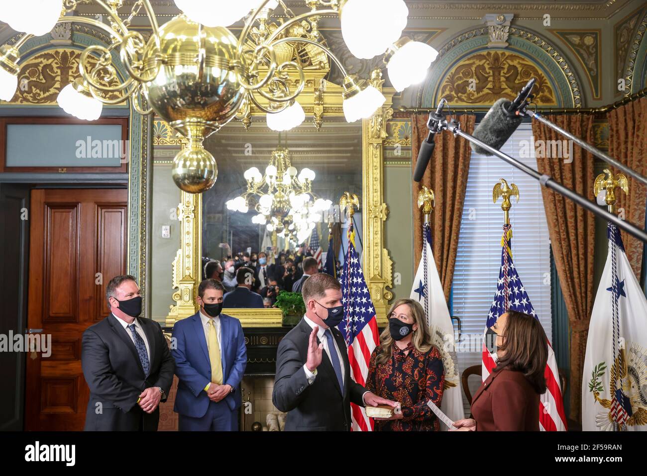 Vice President Kamala Harris, right swears-in, Marty Walsh center, as ...