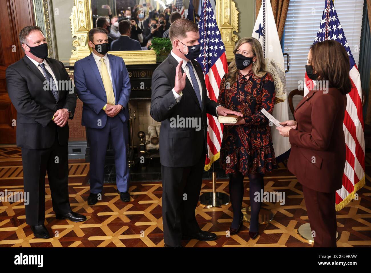 Vice President Kamala Harris, right swears-in, Marty Walsh center, as ...
