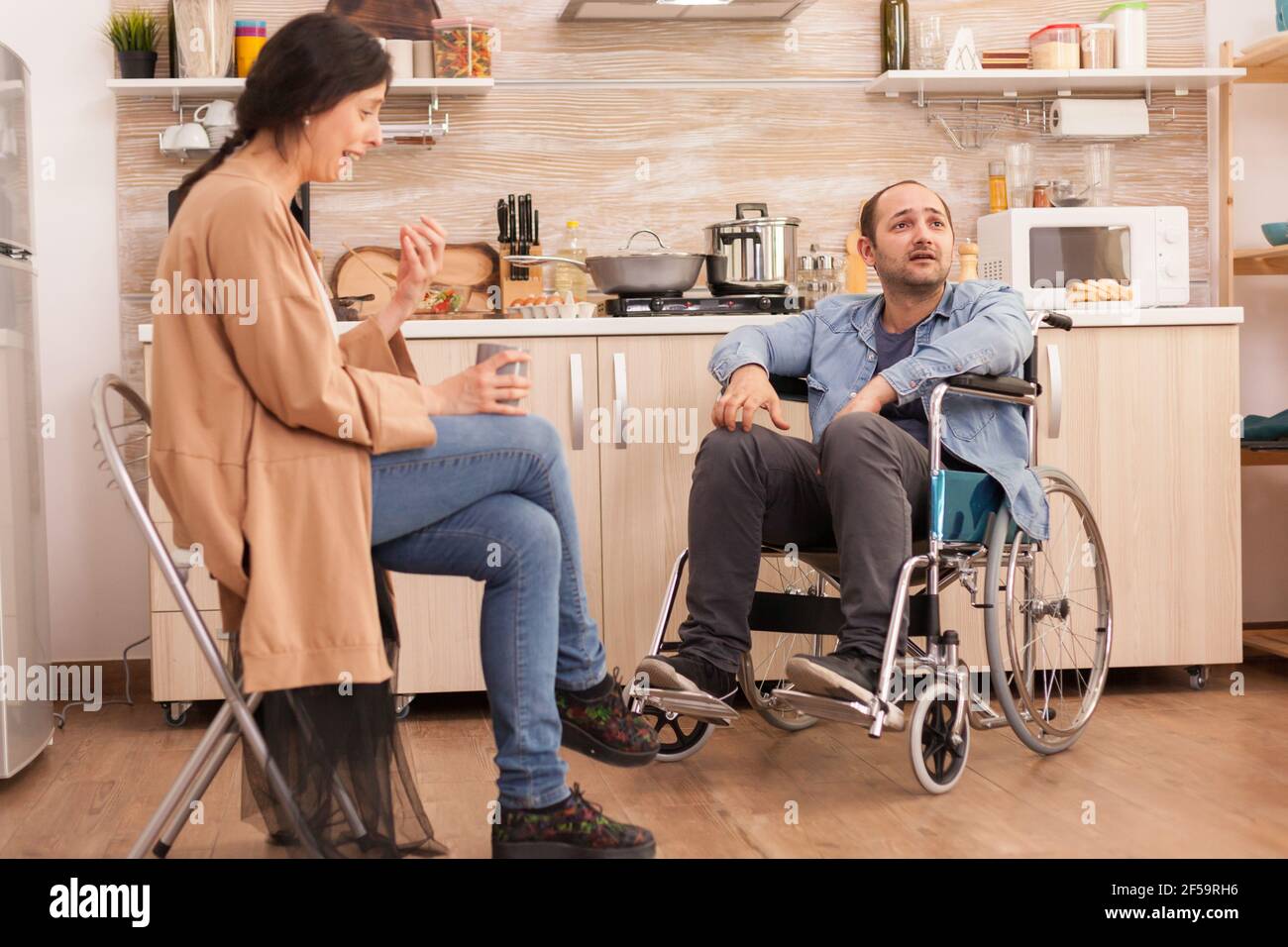 Wife crying because of disagreement with disabled husband in wheelchair ...