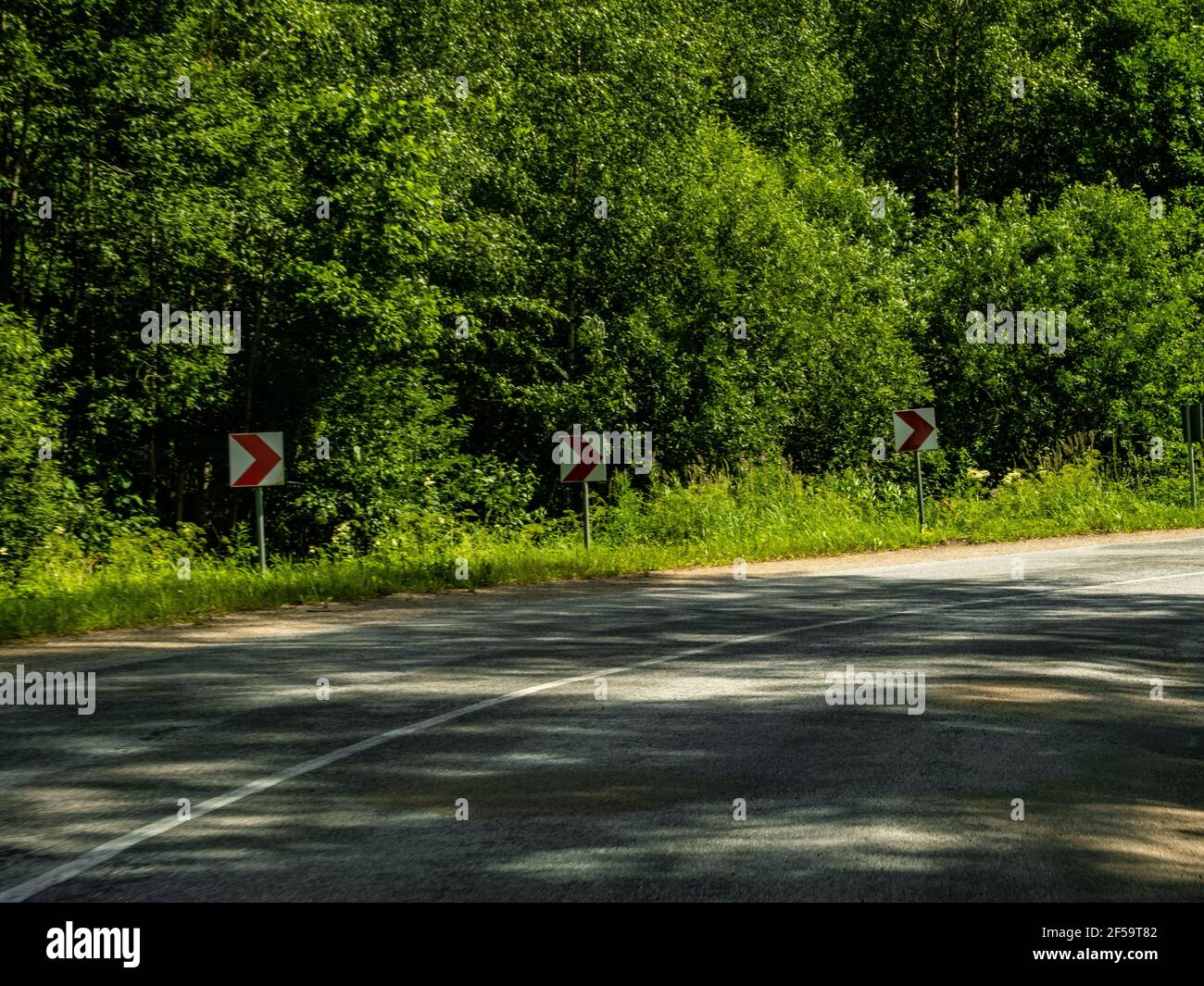 Asphalt highways road surrounded by forest, road sign, land transport ...