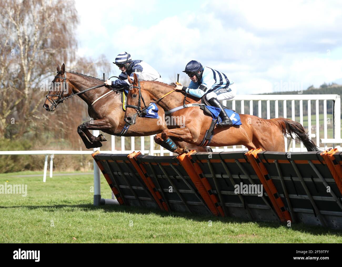 Fontana Ellissi ridden by jockey Sam Twiston-Davies (left) on their way ...