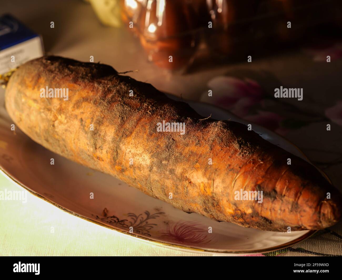 Fresh organic sand carrot with soil Stock Photo - Alamy
