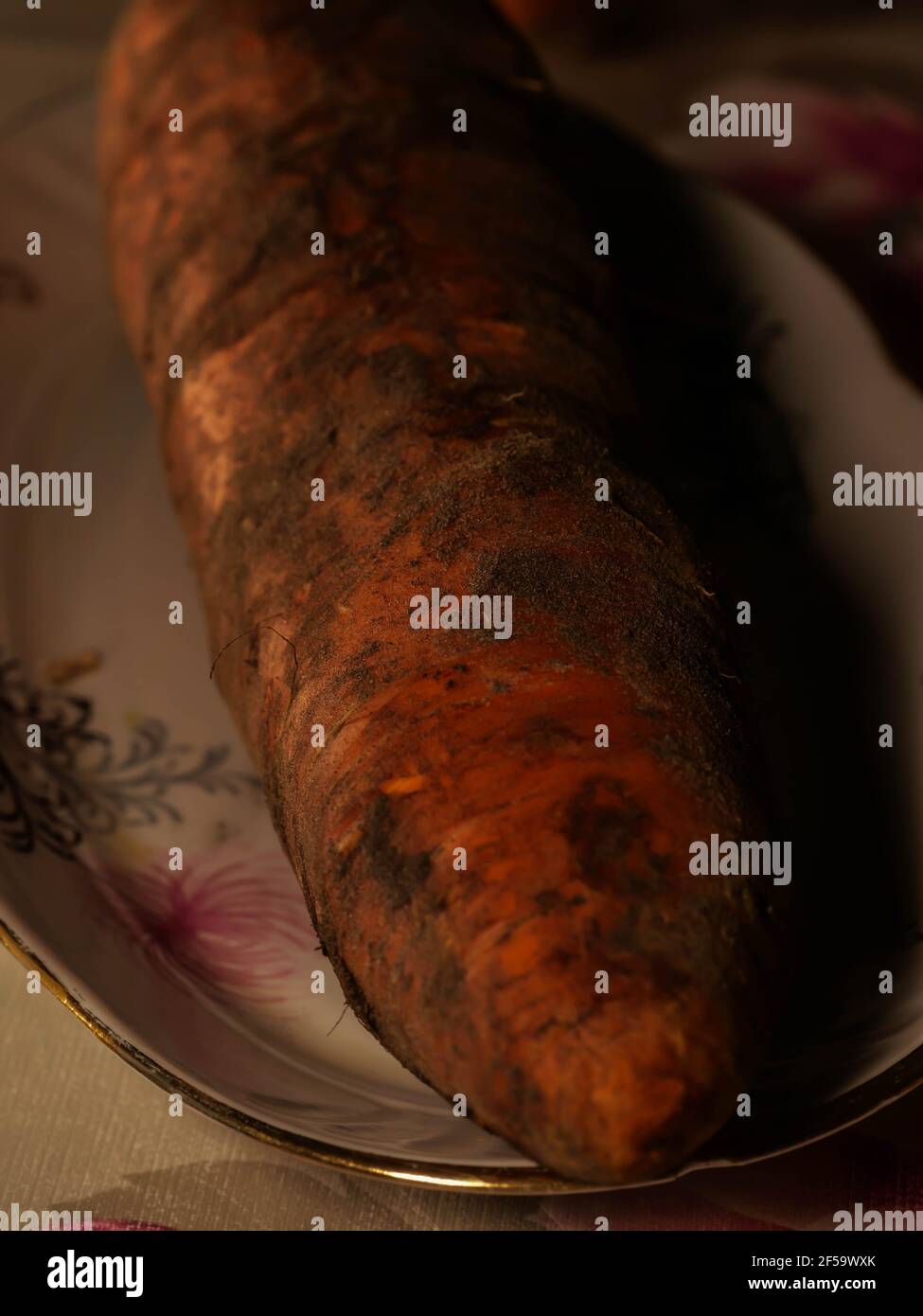 Fresh organic sand carrot with soil Stock Photo - Alamy