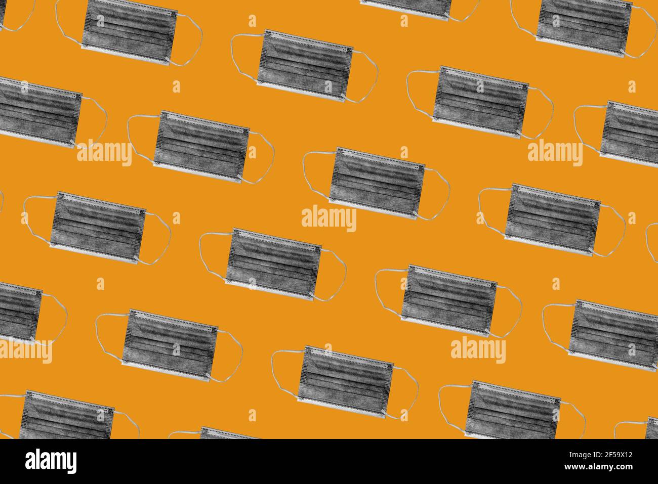 Black medical mask on an orange background. Covid-19 protection Stock ...