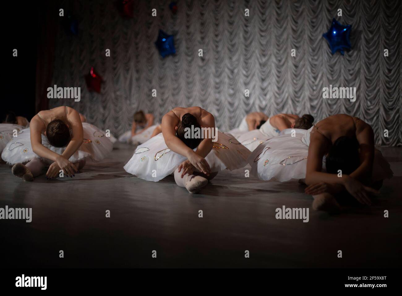 Ballerinas are in a row. The girls are lined up one after the other on the stage. Ballerinas in ...