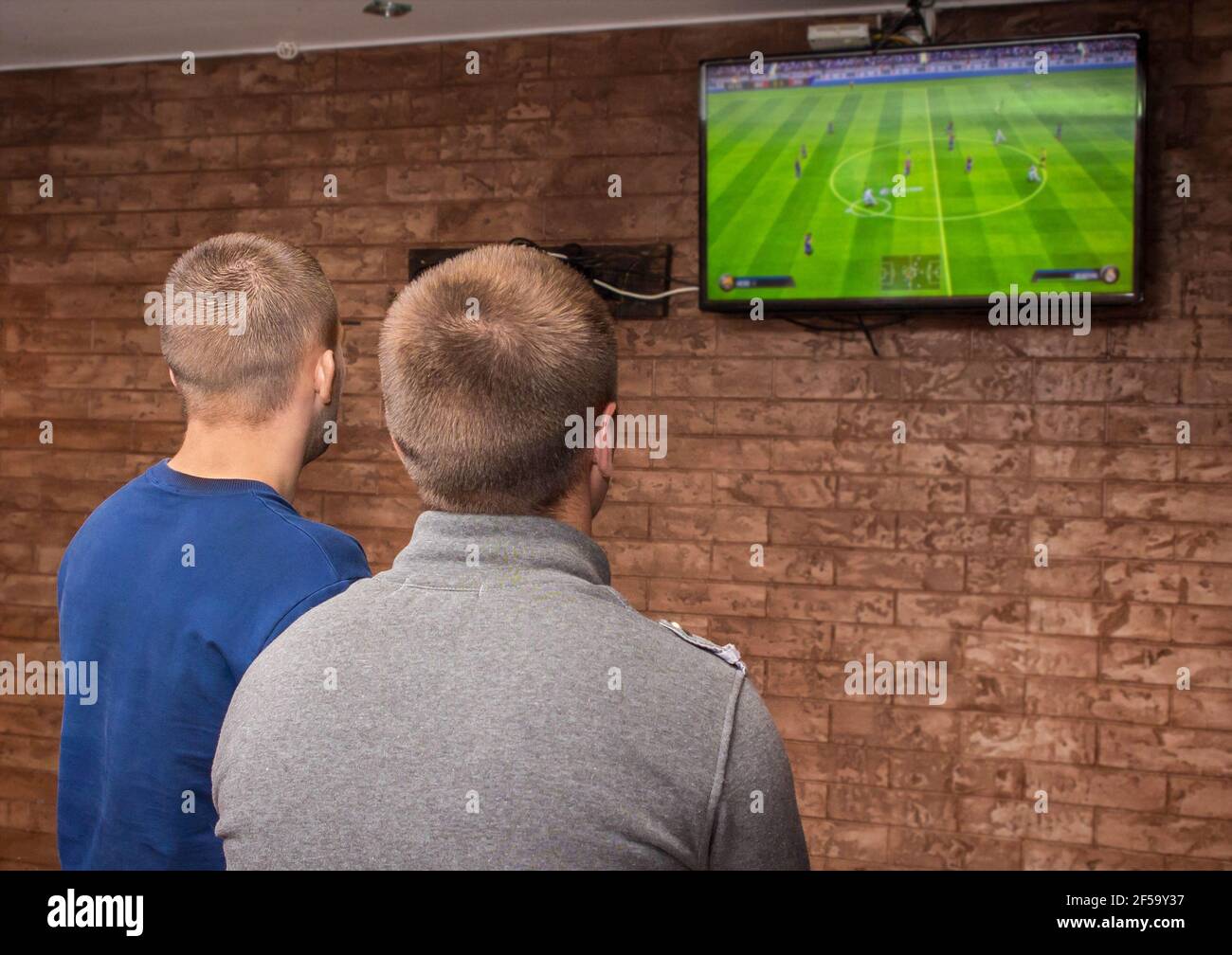 Two guys playing video games hi-res stock photography and images - Alamy