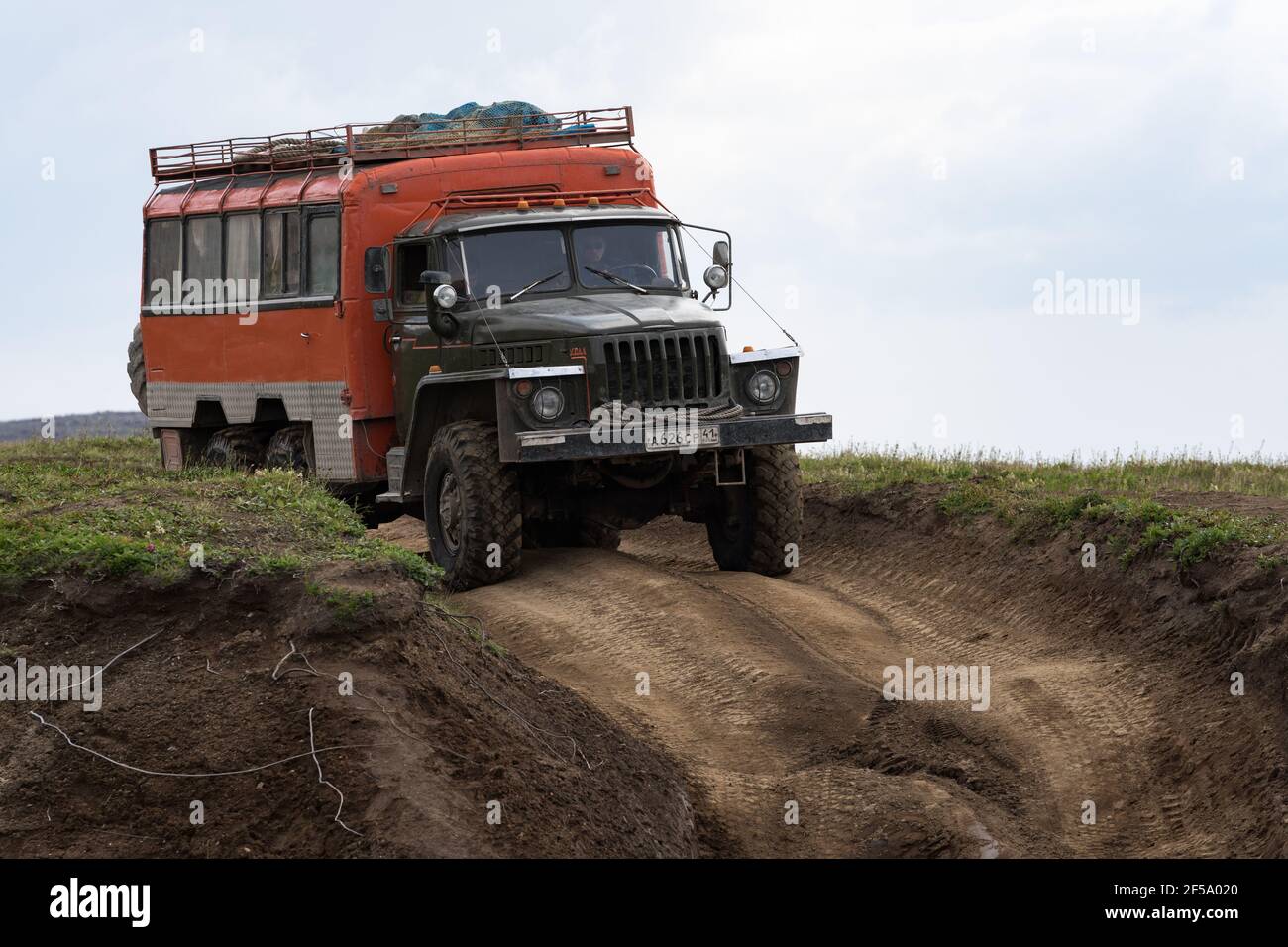 Russian off-road extreme expedition truck Ural driving on mountain road ...