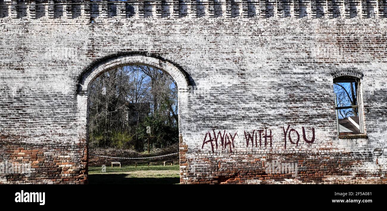 weathered and old brick wall around the small town cemetery Stock Photo ...