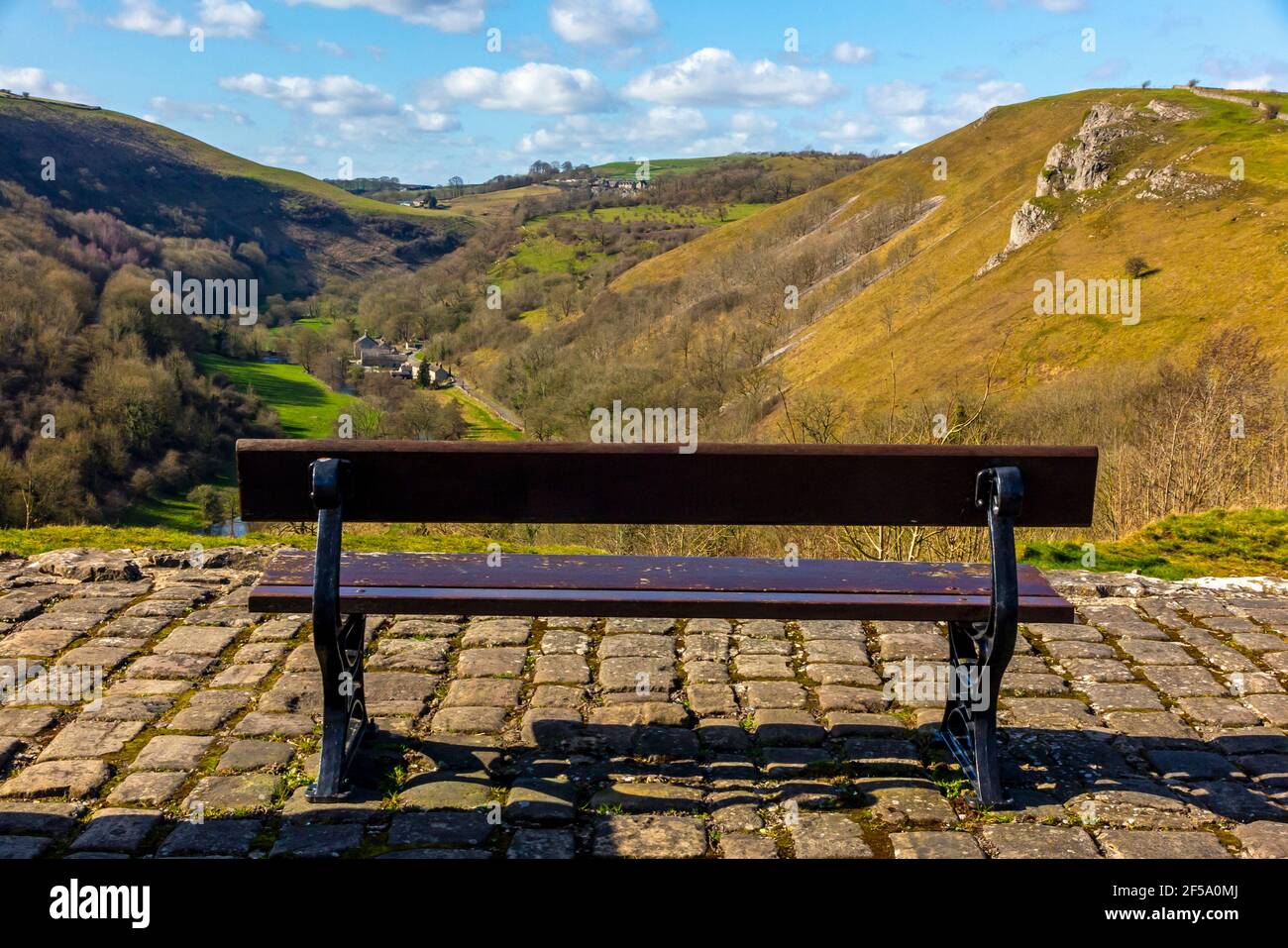 Wooden bench in early spring sunshine at Monsal Head a popular ...