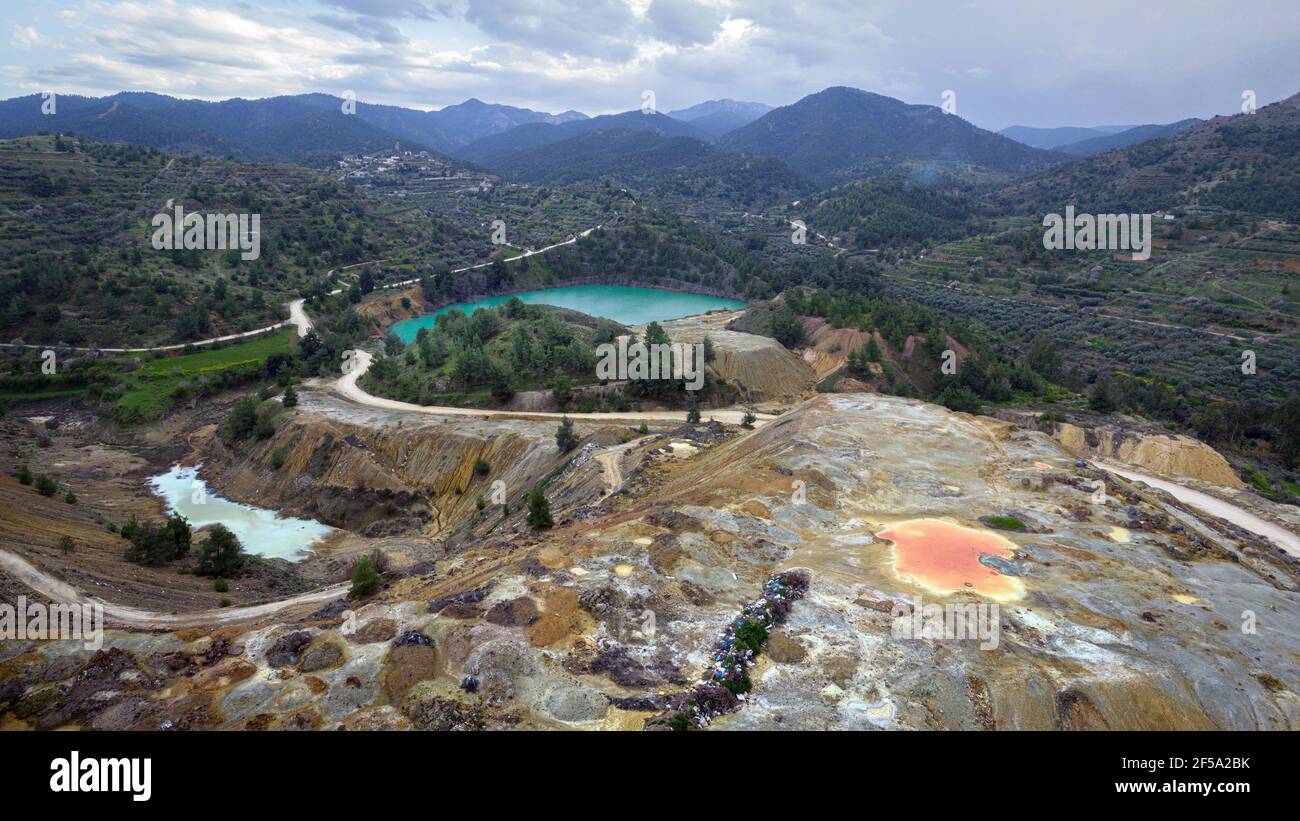 Multicolored waste rocks and tailings from mining near abandoned open ...
