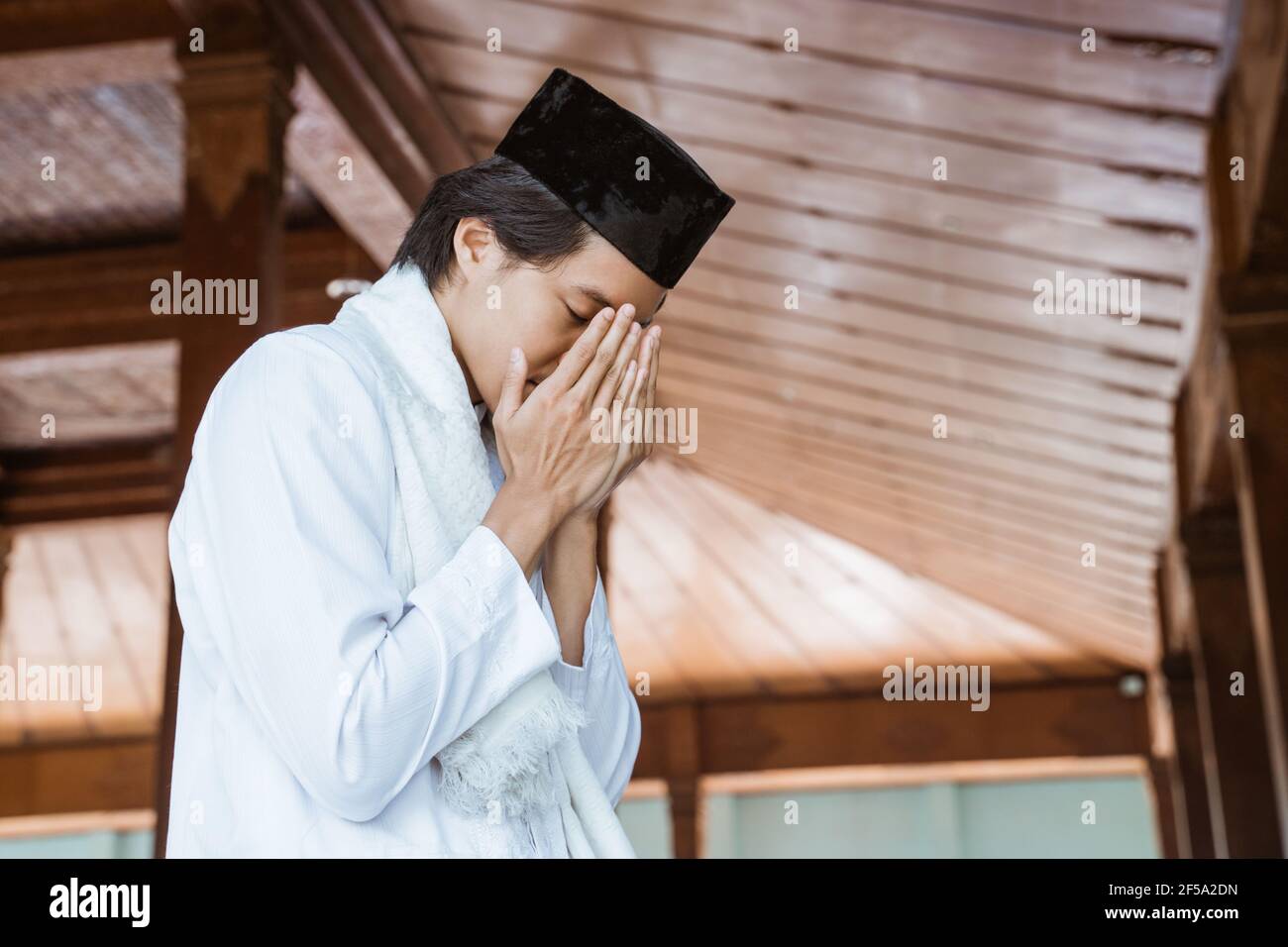 Muslim man worships and prays for Allah in Stock Photo - Alamy
