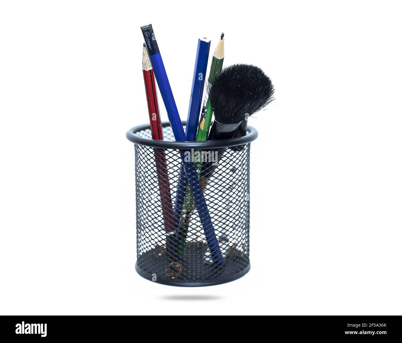 Round-shaped metallic net box with several pencils in it on white ...