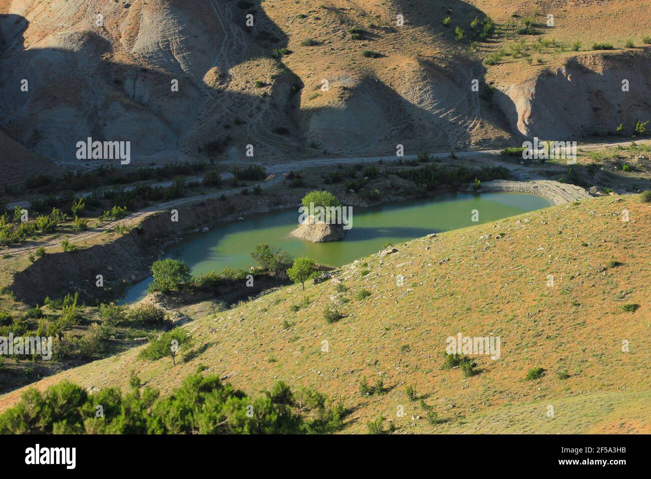 Lake with a tree in the Khizi mountains at sunset. Azerbaijan Stock ...