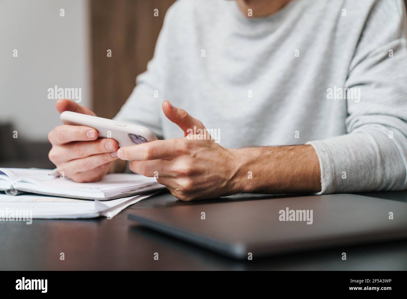 Man using mobile phone while working hi-res stock photography and ...