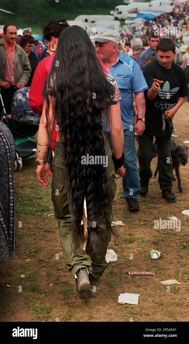 A Woman walks through the crowd at Gypsy Horse Fair 1998at Stow on the ...