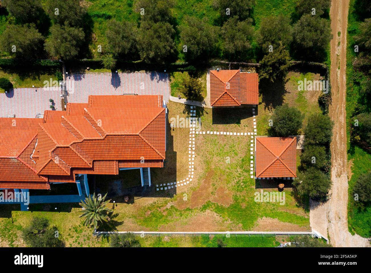 Top aerial view from above to countryside plan with red tile roofs ...
