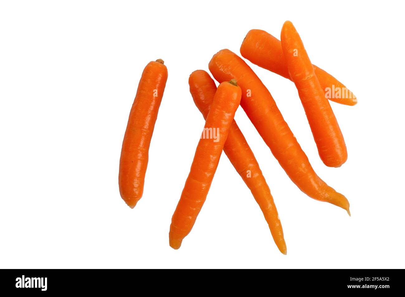 Organic mini snack carrots on white background Stock Photo - Alamy