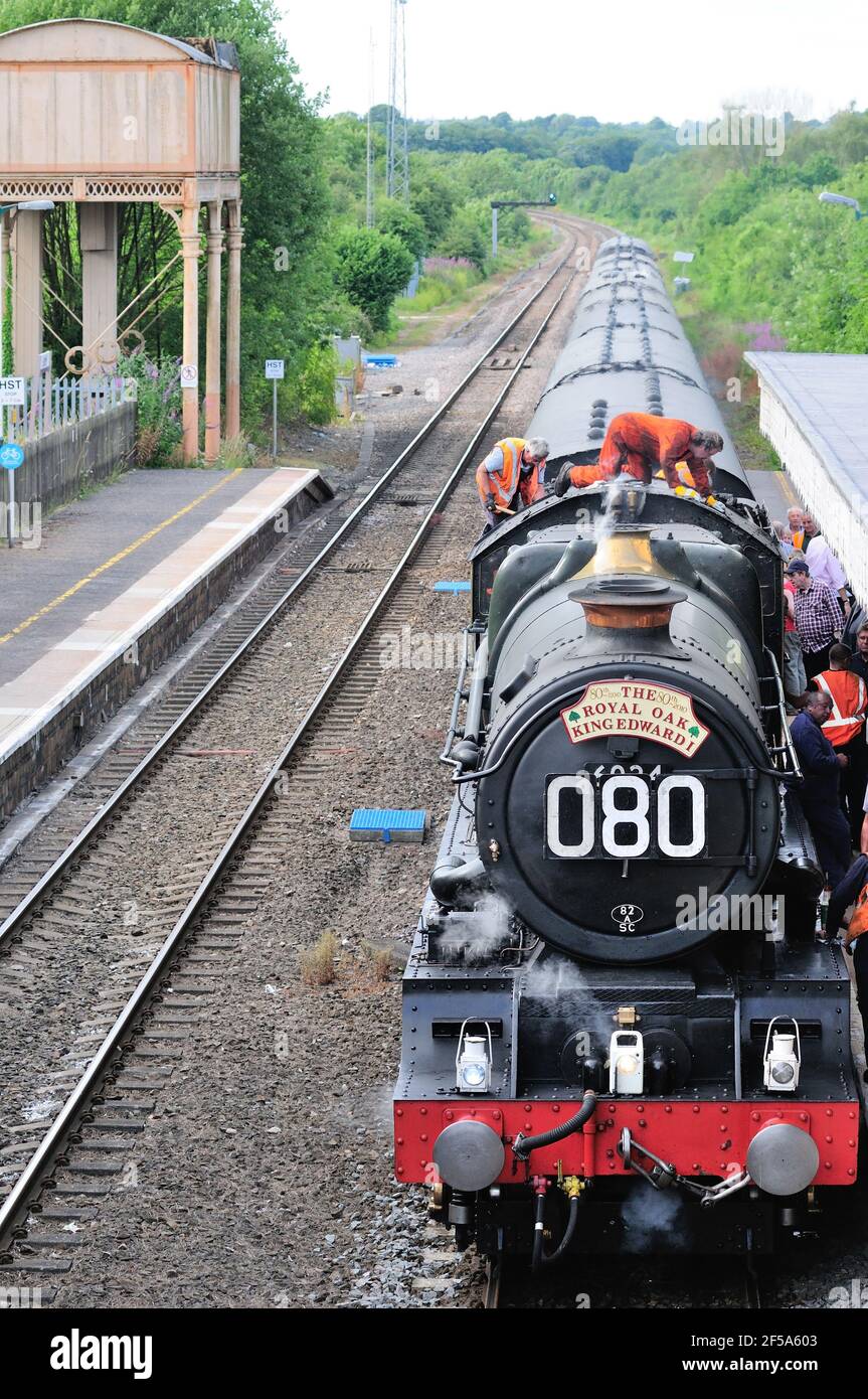 GWR locomotive No 6024 King Edward 1 being serviced during a water stop ...
