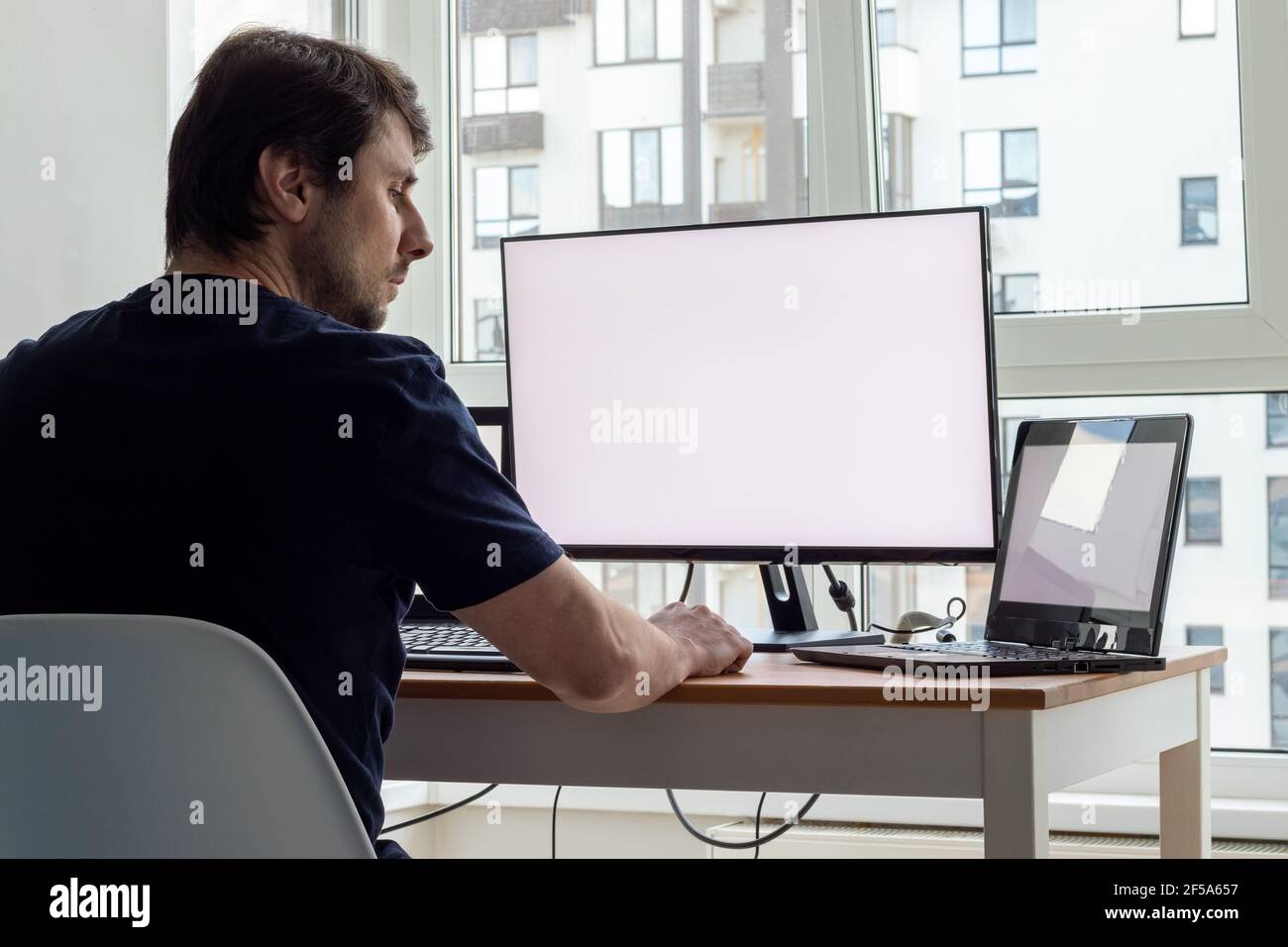 Laptops at work hi-res stock photography and images - Alamy