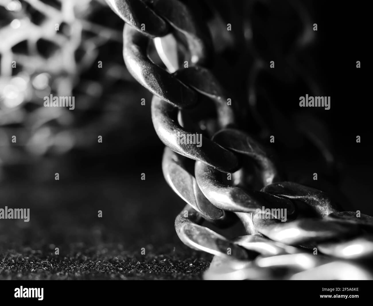 Cuban link silver chain on black background Stock Photo - Alamy