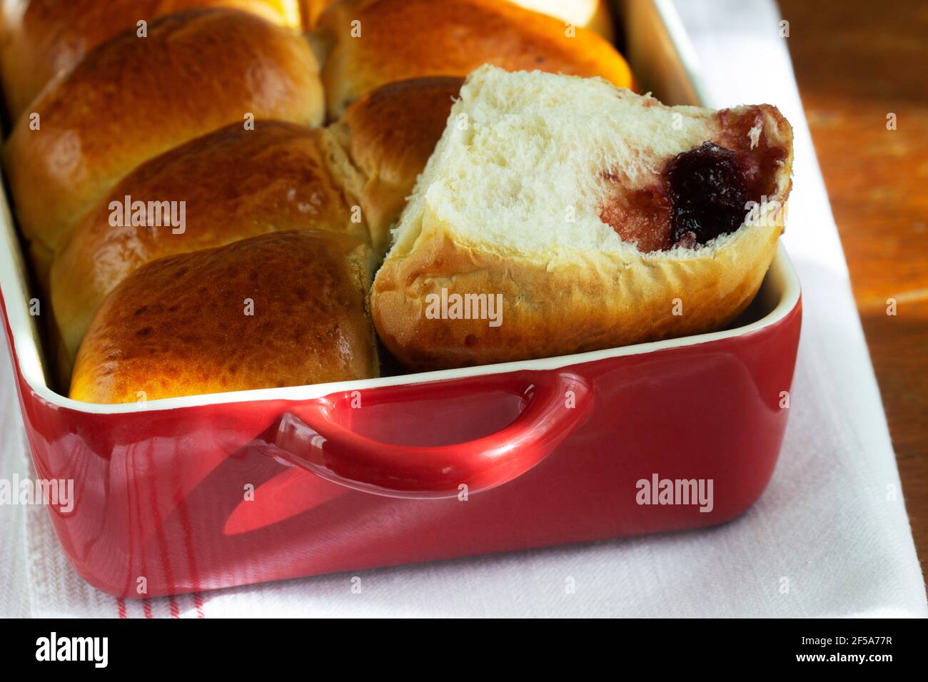 Austrian buns with cherry filling in a baking dish. Rustic style Stock ...
