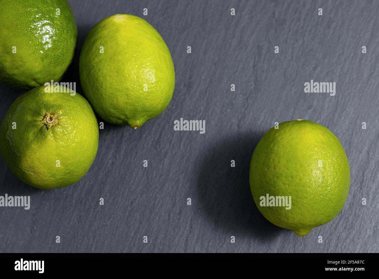 Abstract lime on black background as hi-res stock photography and ...
