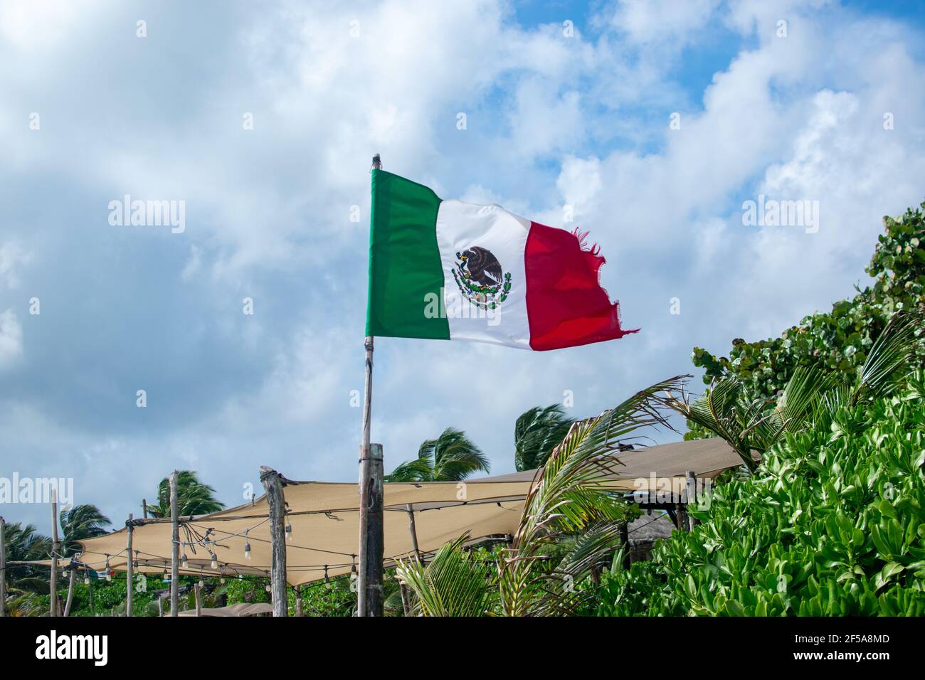 Closeup view of the flag of Mexico hanging from the pole next to the ...