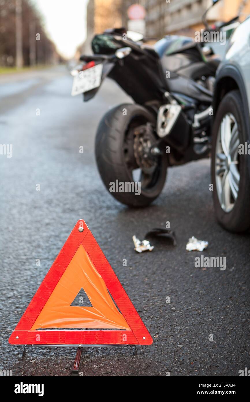 Emergency road triangle sign is on asphalt, road accident with a car ...