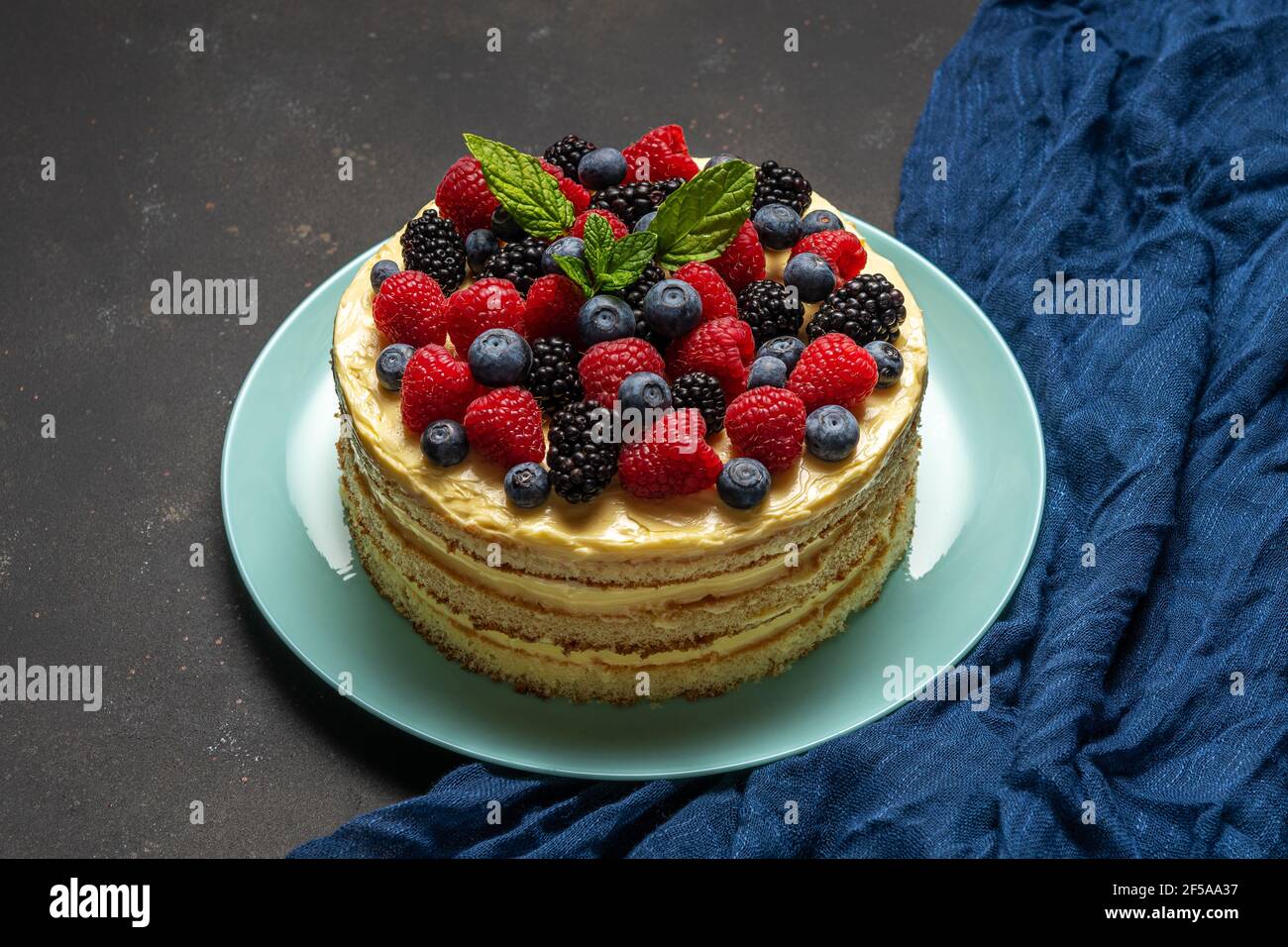Homemade cake with fresh berries on dark background Stock Photo - Alamy