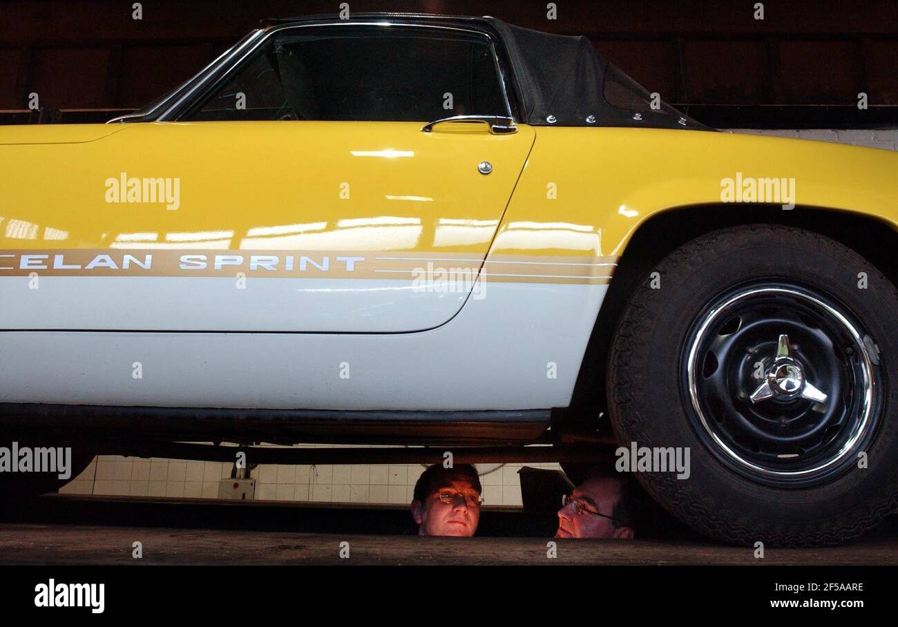 PAUL MATTY SHOWS JAMES RUPPET A LOTUS ELAN SPRINT, IN HIS WORKSHOP IN ...