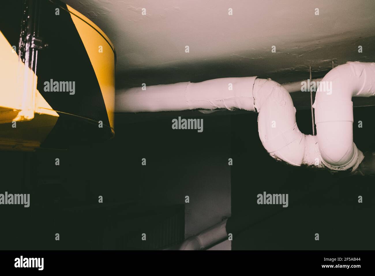 Drain pipes inside a dark basement Stock Photo - Alamy