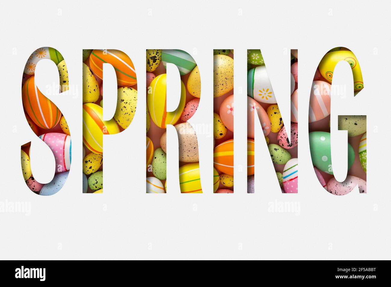 Word SPRING shape cut in the white paper with different colorful Easter ...