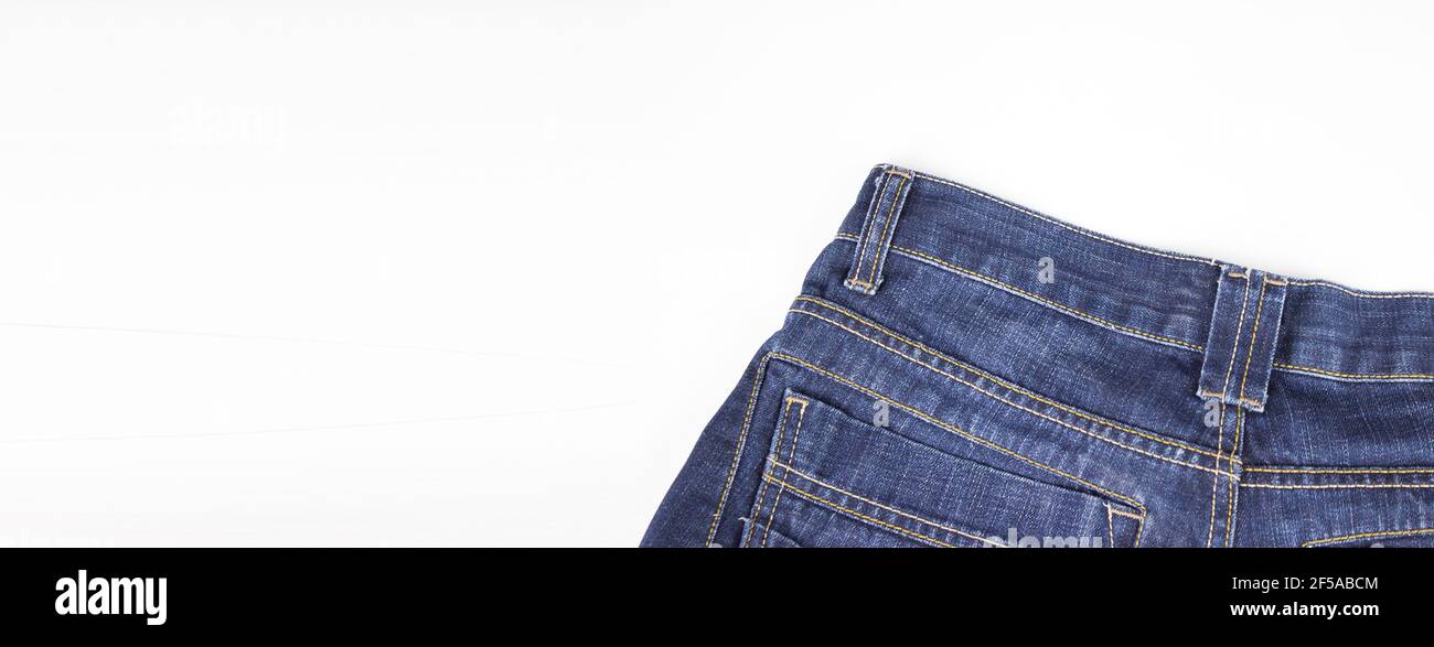 Back upper part of jeans on white background. Copy space. Clothing ...