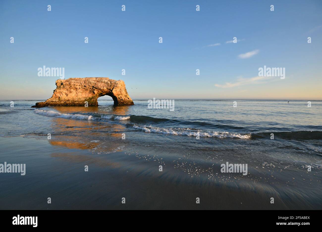Sunset landscape with scenic view of Natural Bridges State Beach with ...
