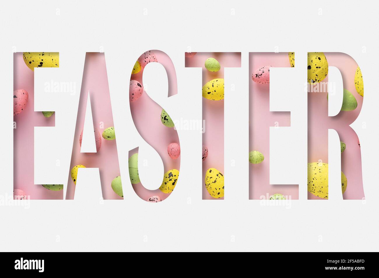 Word EASTER shape cut in the white paper with different colorful Easter ...